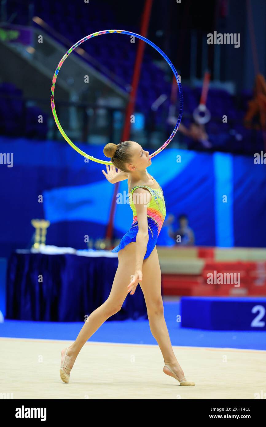 Young gymnast demonstrates artistry and precision in rhythmic ...