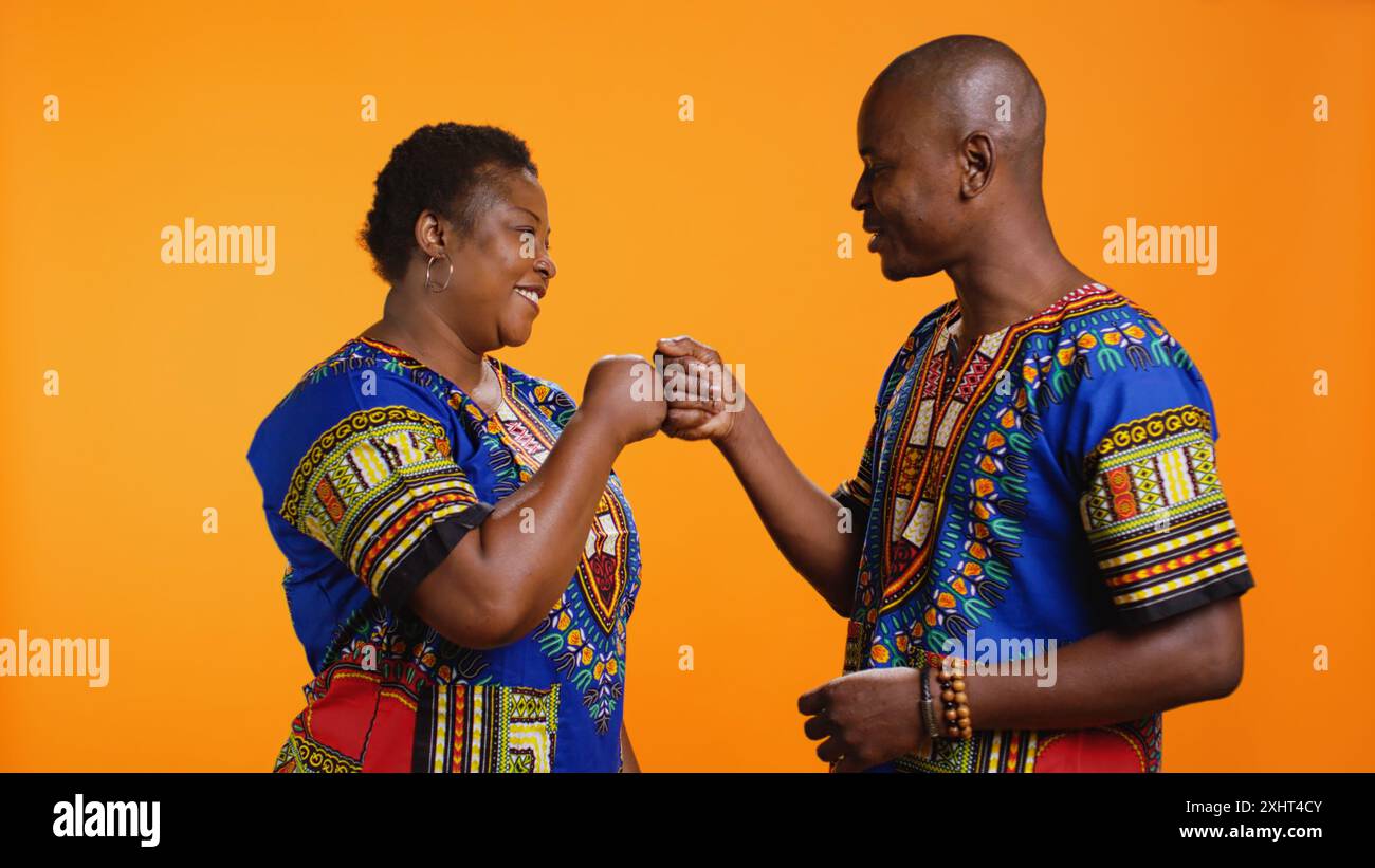 Young african american people greeting with fist bump on camera, saying ...