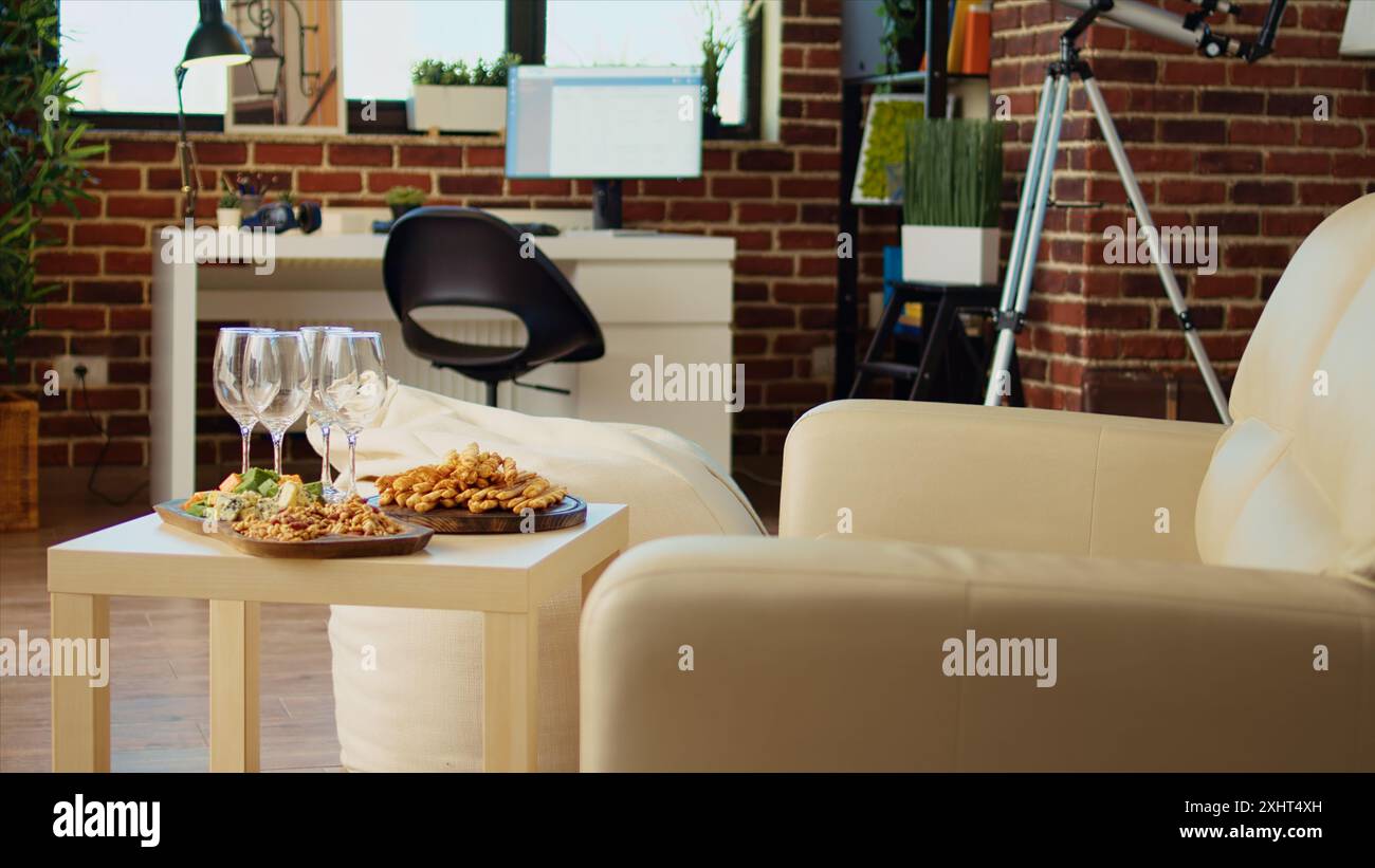 Empty stylish cozy apartment living room with crackers, peanuts and ...