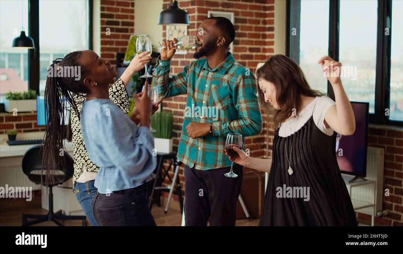 Energetic group of friends dancing at apartment party, having fun ...