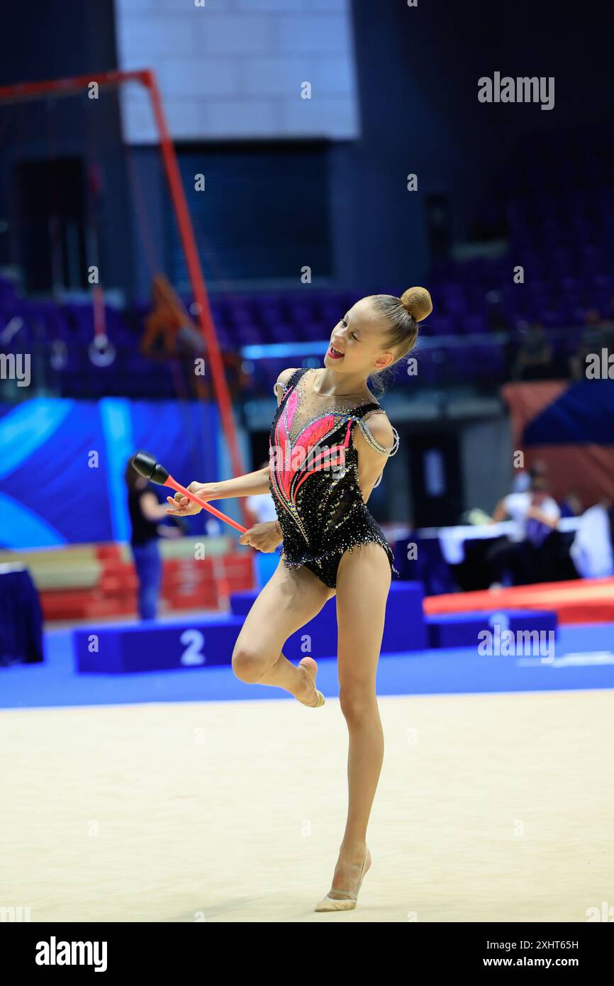Rhythmic gymnast shows talent, strength, and grace with a ribbon in ...