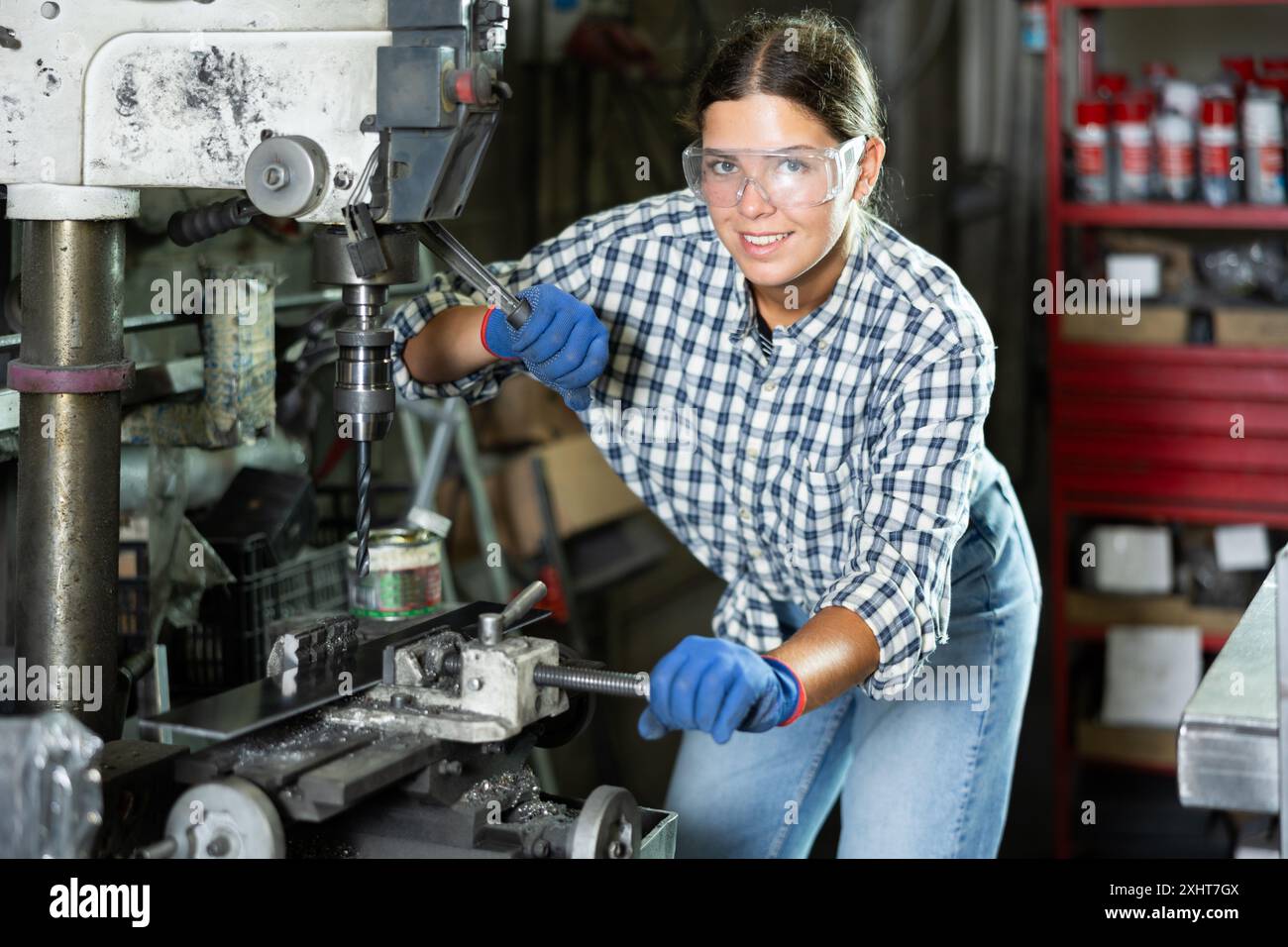 Young woman working with drill machine Stock Photo - Alamy