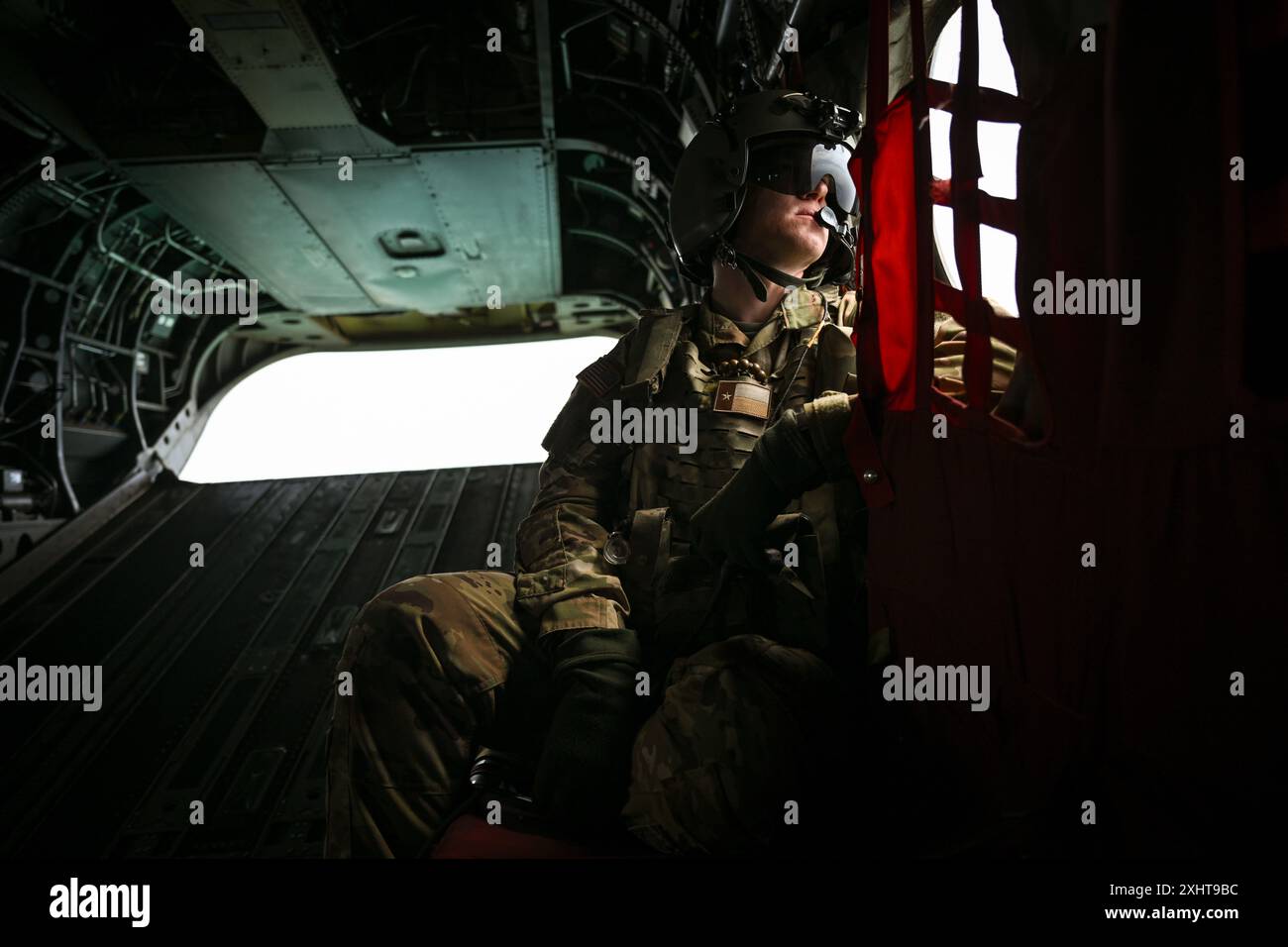 A U.S. Army flight engineer assigned to 3rd Battalion, 25th Aviation ...