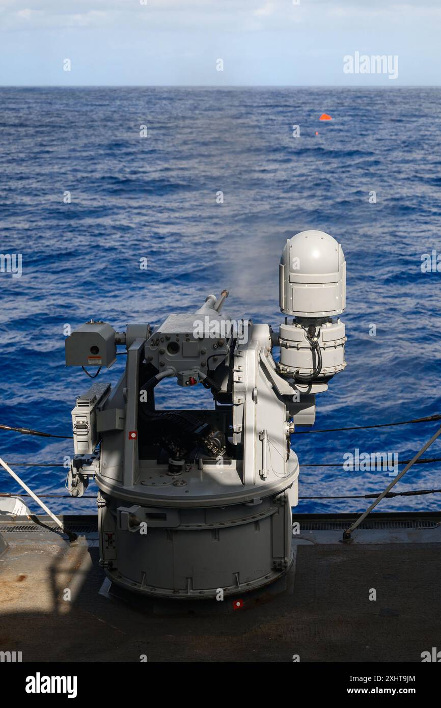 A MK-38 25mm machine gun system fires at an Inflatable Naval Gunnery ...