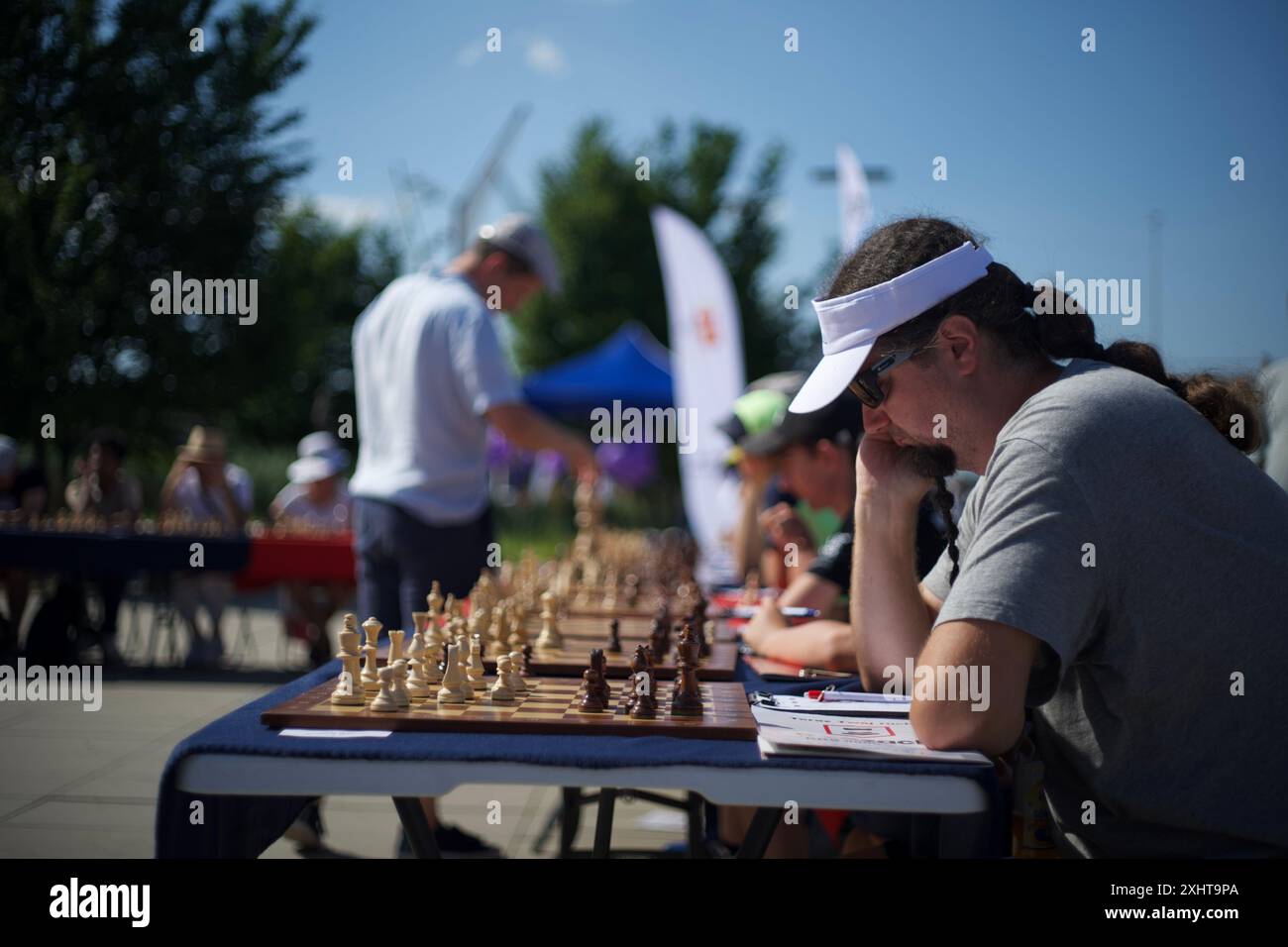 Chess player deep in thought Stock Photo - Alamy