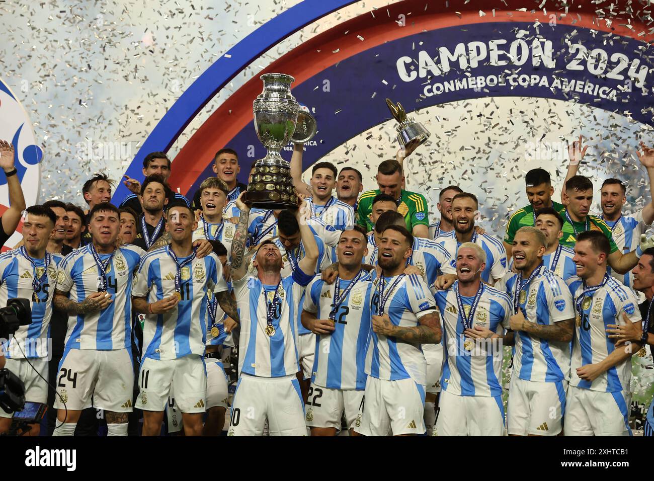 Argentina s forward Lionel Messi C lifts the trophy during the ...