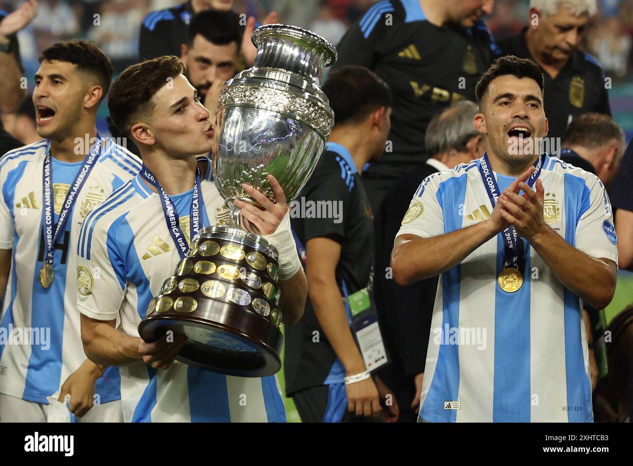 Argentina s forward Julian Alvarez celebrates with the trophy after his ...
