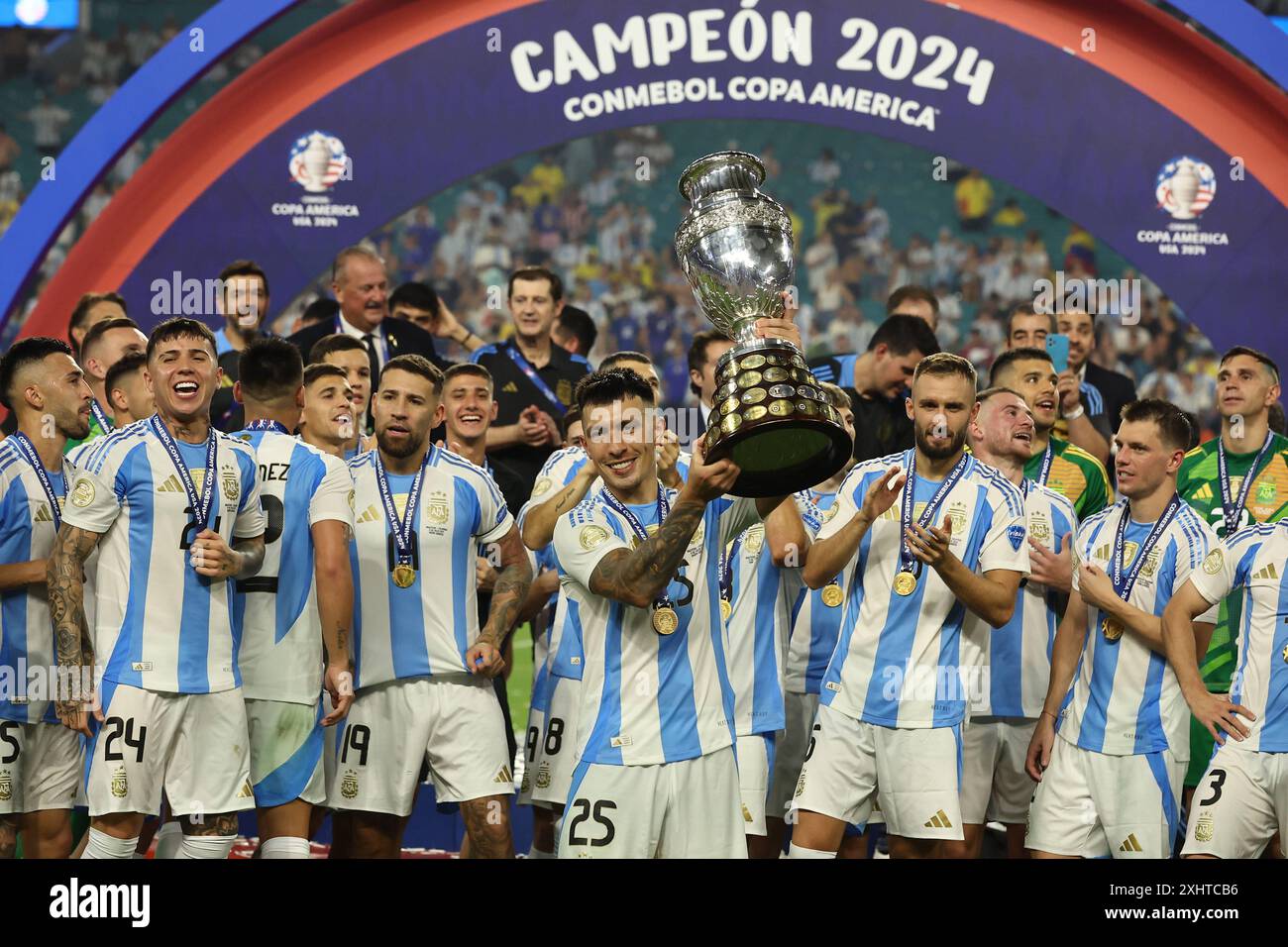 Argentina s defender Lisandro Martinez C holds up the trophy during the ...