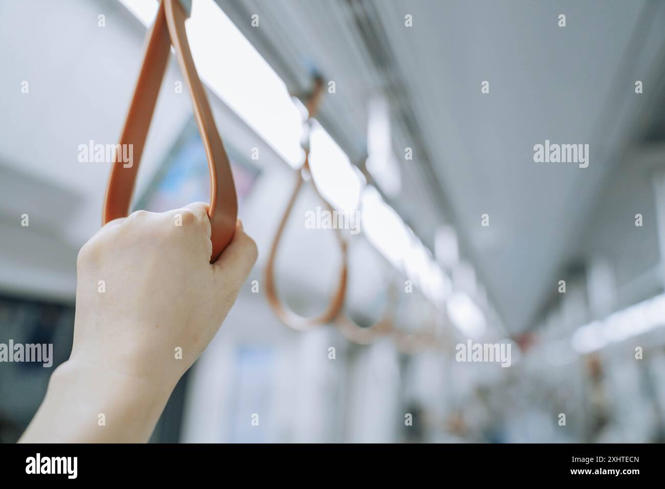Train passenger standing handle hook on the railing bar, using to ...
