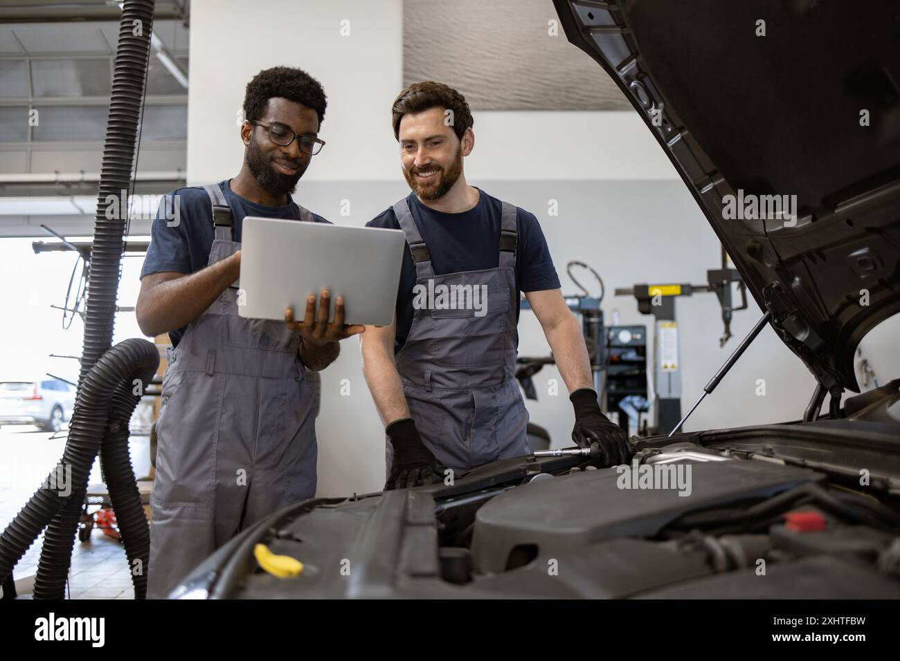 Two caucasian men workers mechanics hi-res stock photography and images ...