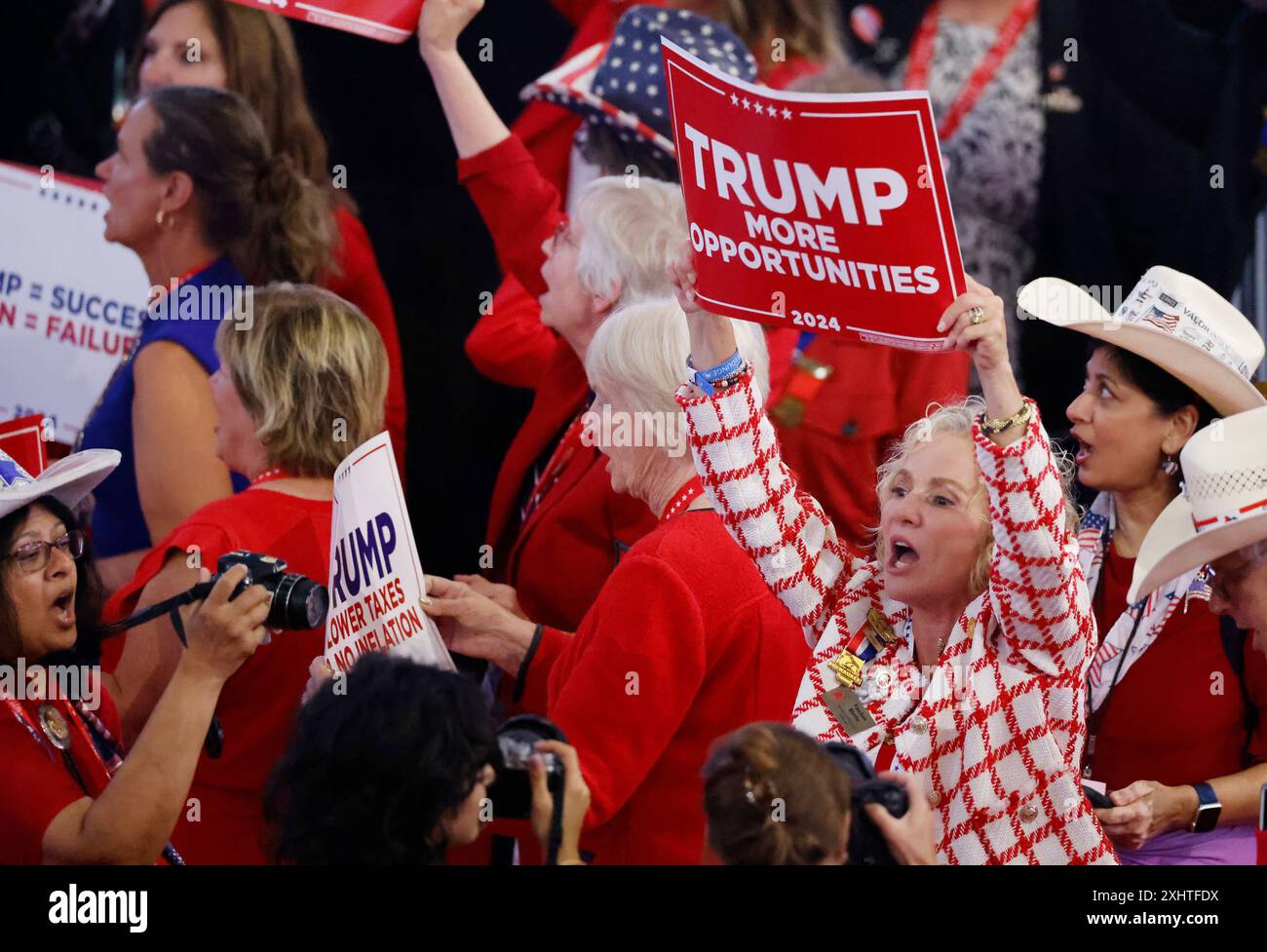Milwaukee, United States. 15th July, 2024. Delegates wave signs at the ...