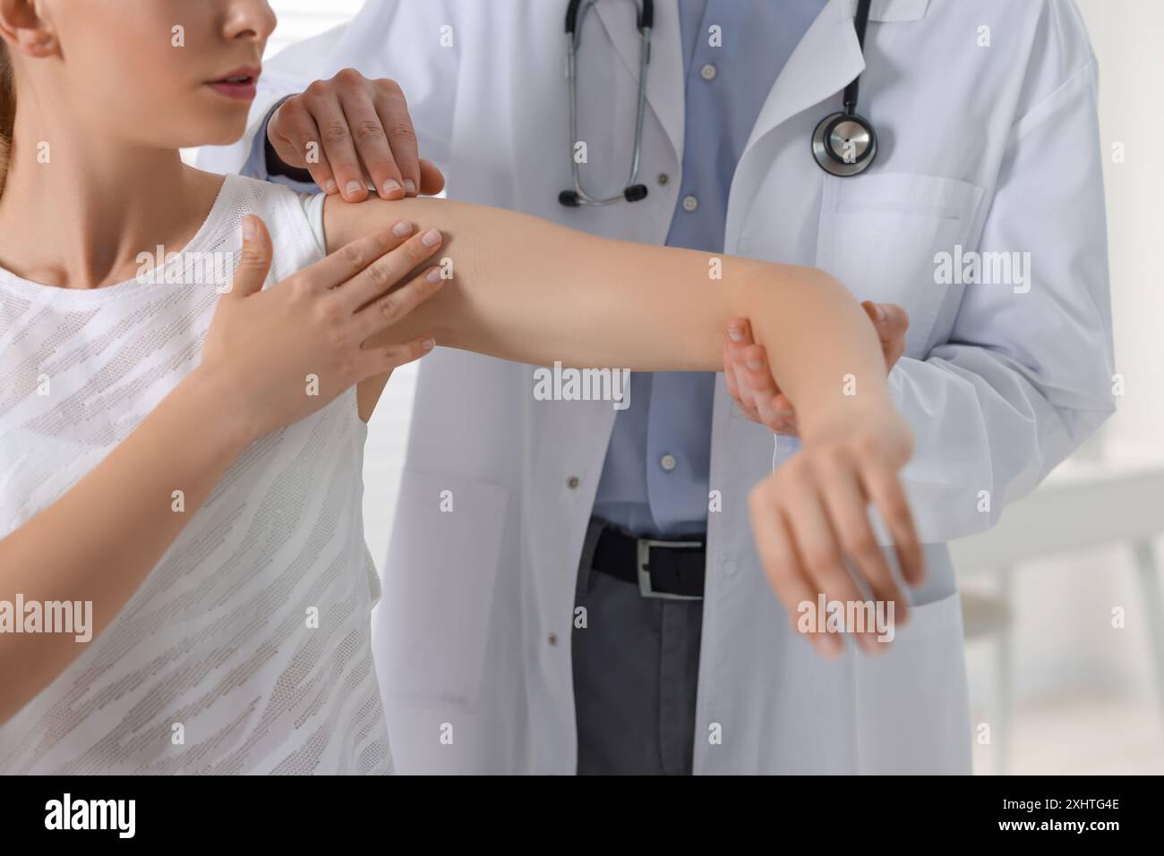 Sports injury. Doctor examining patient in hospital, closeup Stock ...