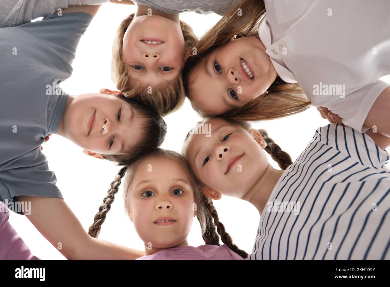Group of cute little children indoors, bottom view Stock Photo - Alamy