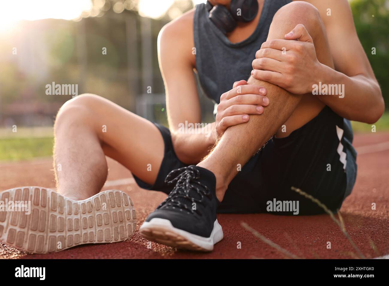 Sportsman with leg injury at stadium, closeup Stock Photo - Alamy