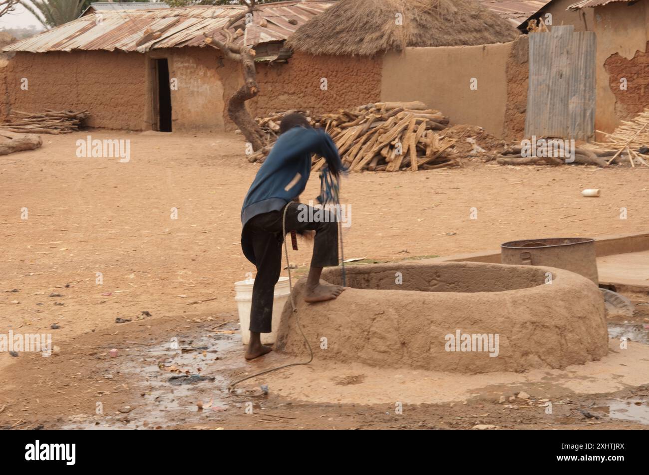 Boy drawing water from a Well, Small village, Bauchi State, Nigeria ...