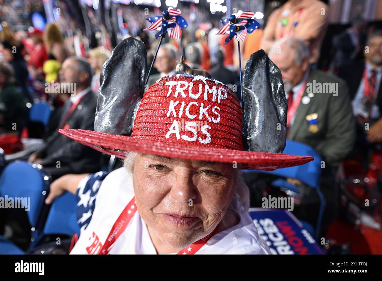 A delegate wears a custom decorated hat on the convention floor of ...