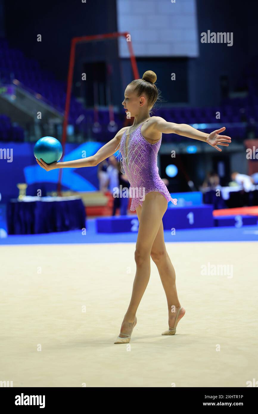 Watch the graceful rhythmic gymnast giving a ball performance in a ...