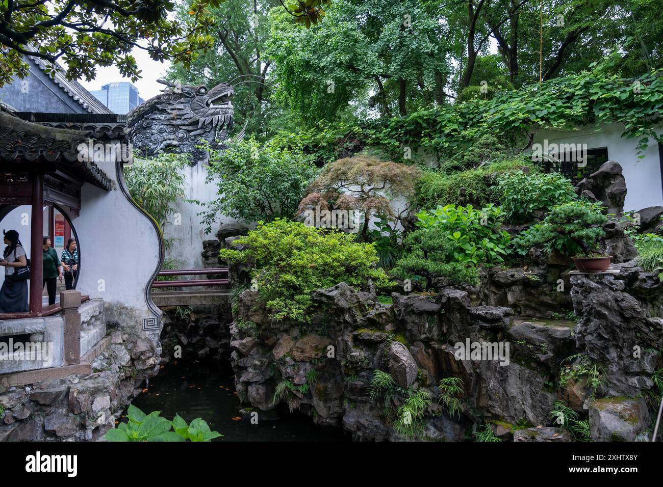 Shanghai, China - June 06, 2024 : A stone dragon sculpture in Yu Garden ...