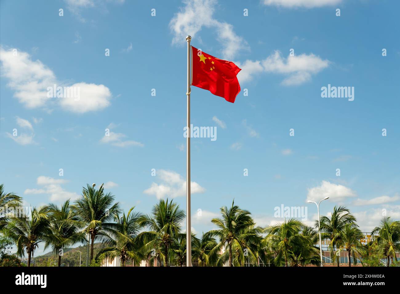 Flag of China flutters by the South China Sea on Hainan island Stock ...