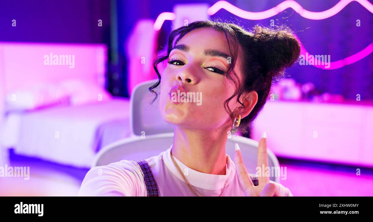 Content creator, girl and selfie or live streaming in neon bedroom with ...