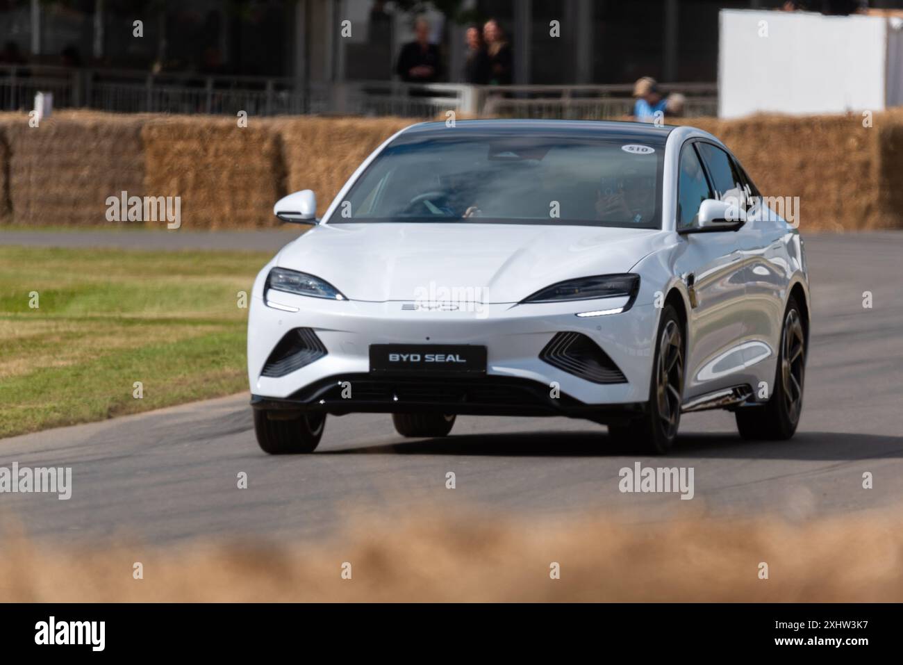 2024 BYD Seal electric car driving up the hill climb track at the ...