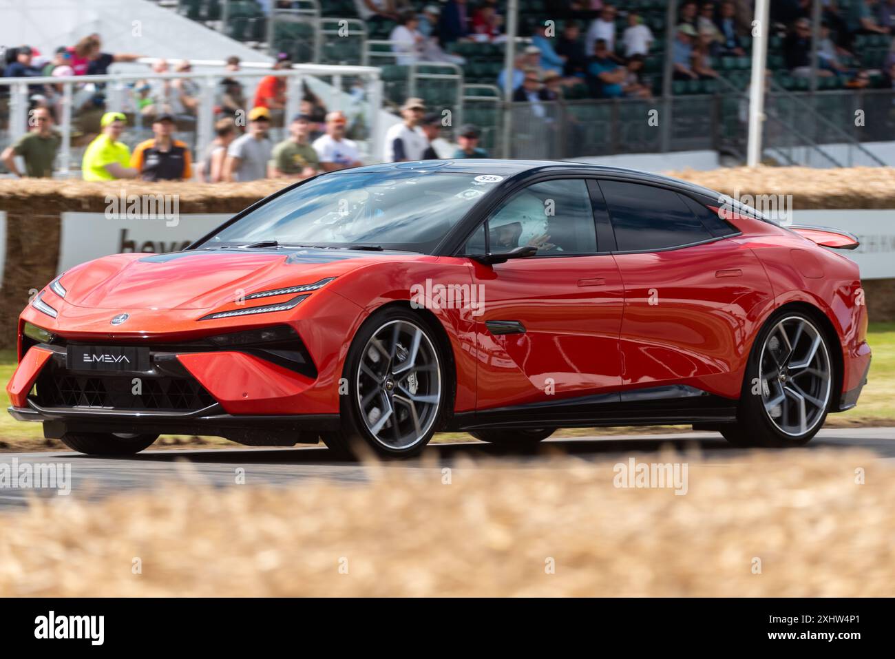 2024 Lotus Emeya R electric car driving up the hill climb track at the ...