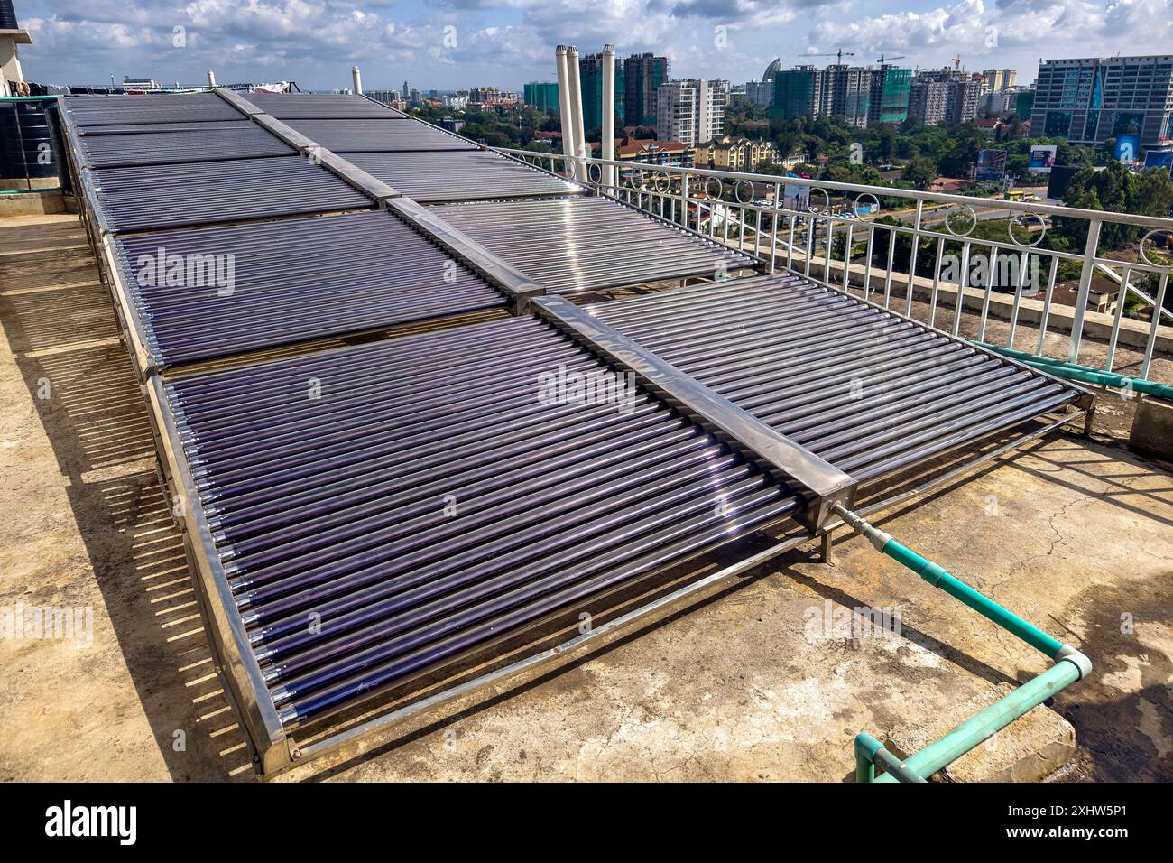 Water tank on the roof over blue sky. Black water tank on the roof of a ...
