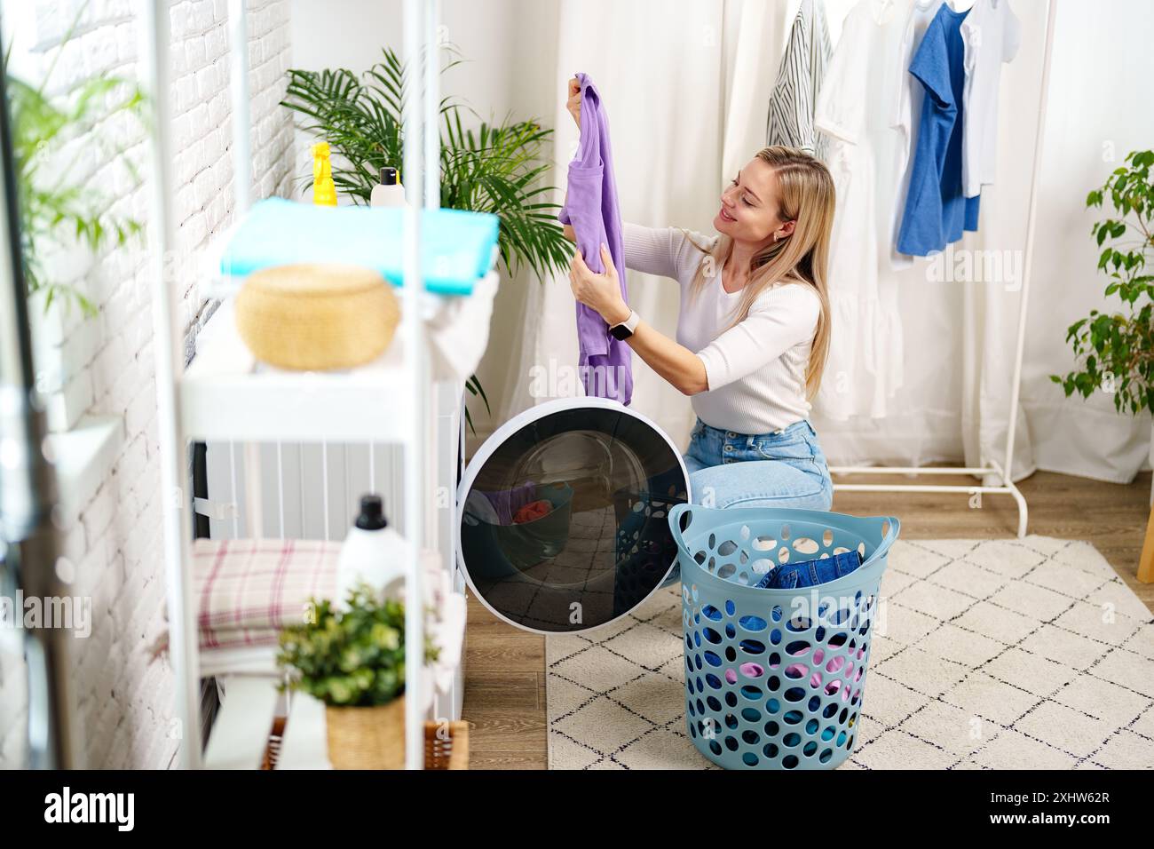 Woman sorting laundry washing machine hi-res stock photography and images - Alamy