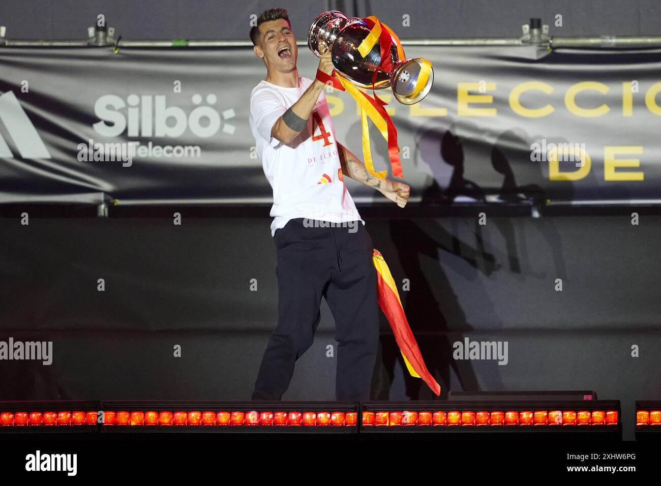 Spanish player Alvaro Morata seen raising the trophy during the ...