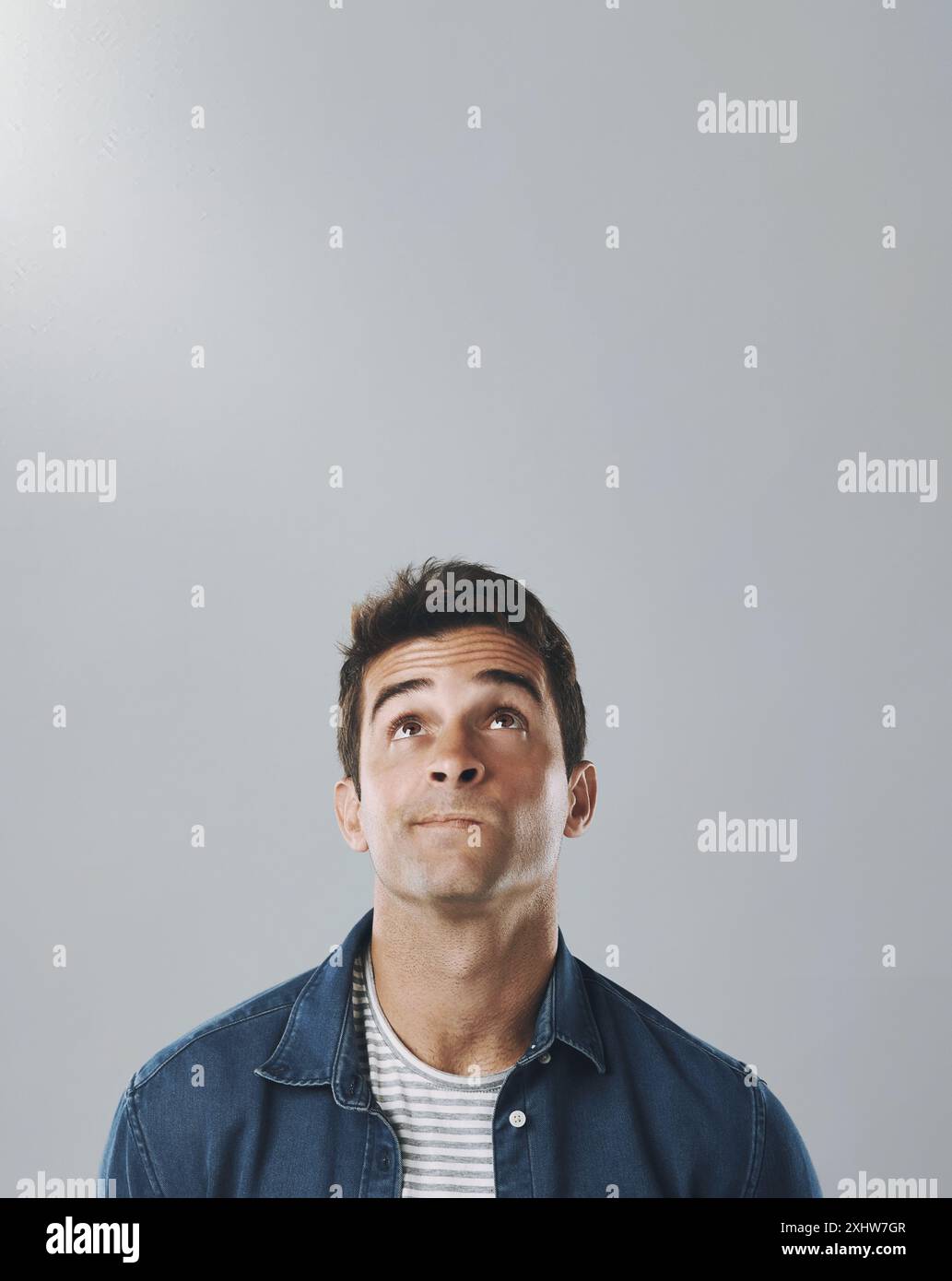 Thinking, studio and man with confusion, doubt and remember of ideas in ...