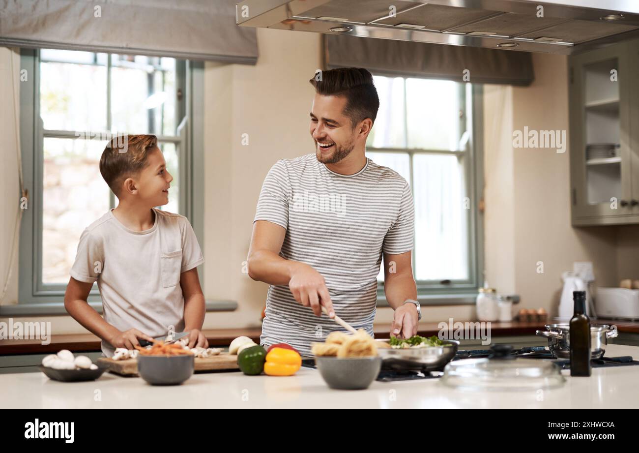 Cooking, dad and son in kitchen, learning and ingredients with time ...