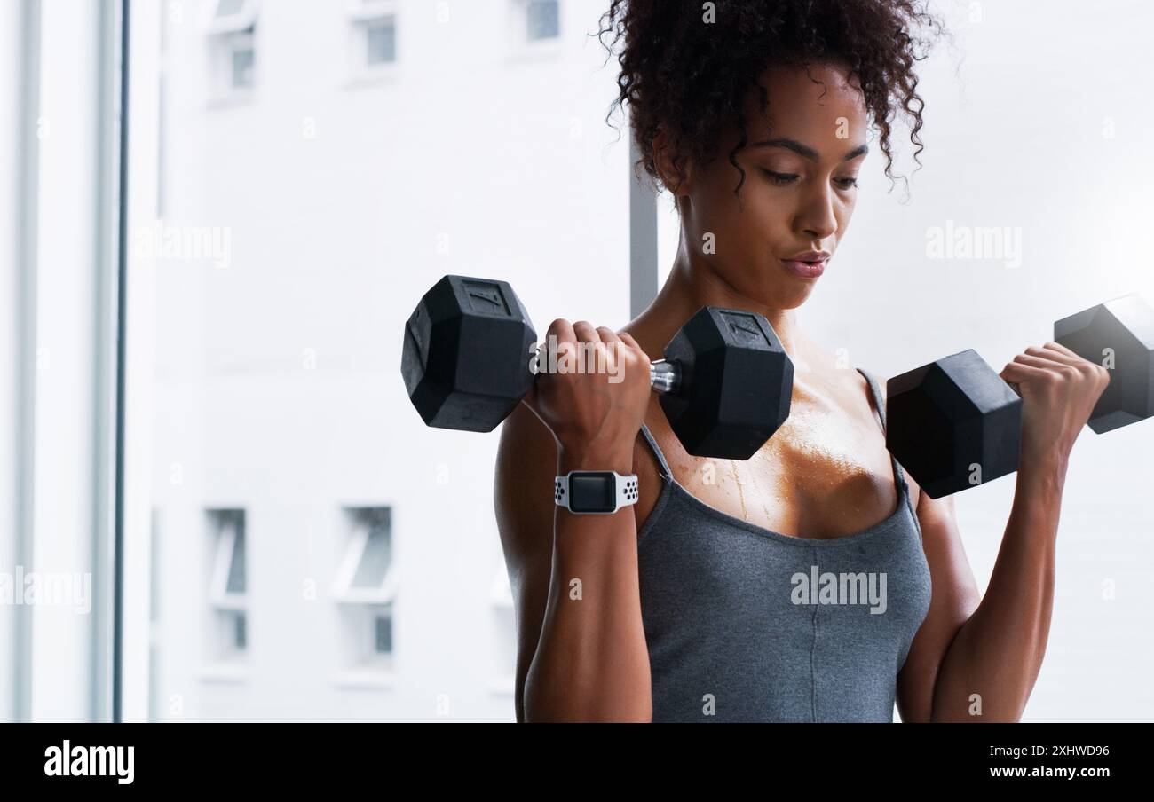 African woman, dumbbells and training at gym with thinking for workout ...