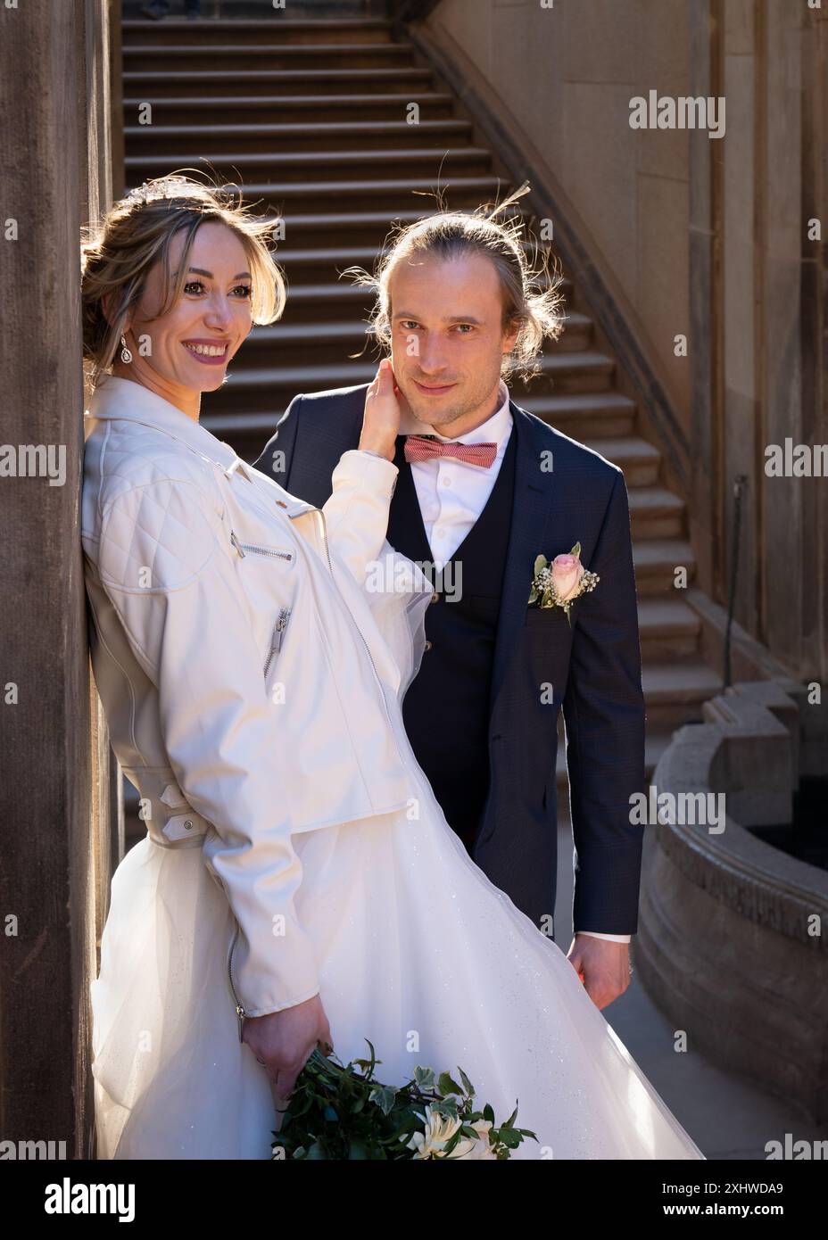 Portrait of a couple in love. The bride and groom stand against the ...