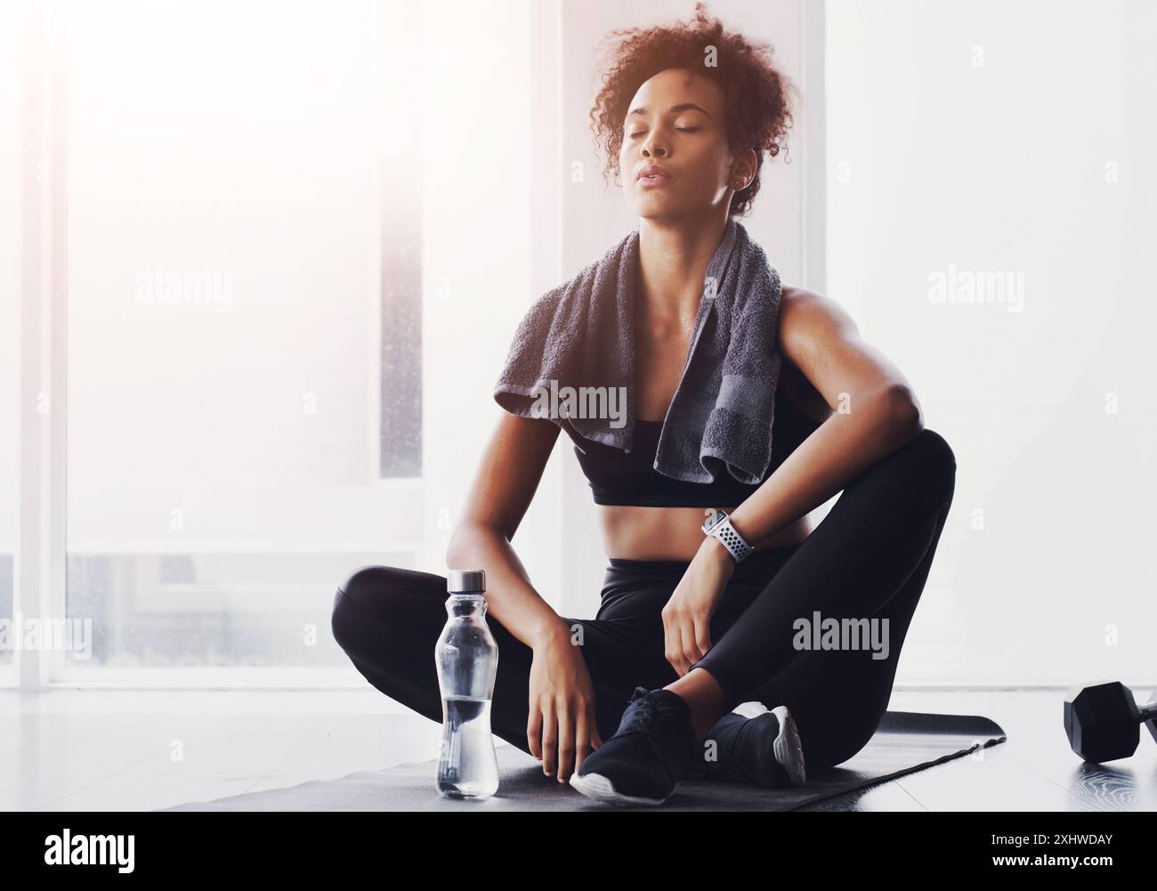 Woman, fitness and tired of workout with relax in gym for exercise ...