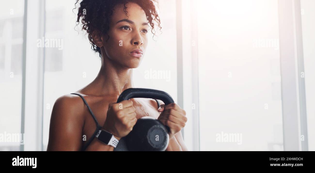 African woman, kettlebell and training at gym with thinking for workout ...
