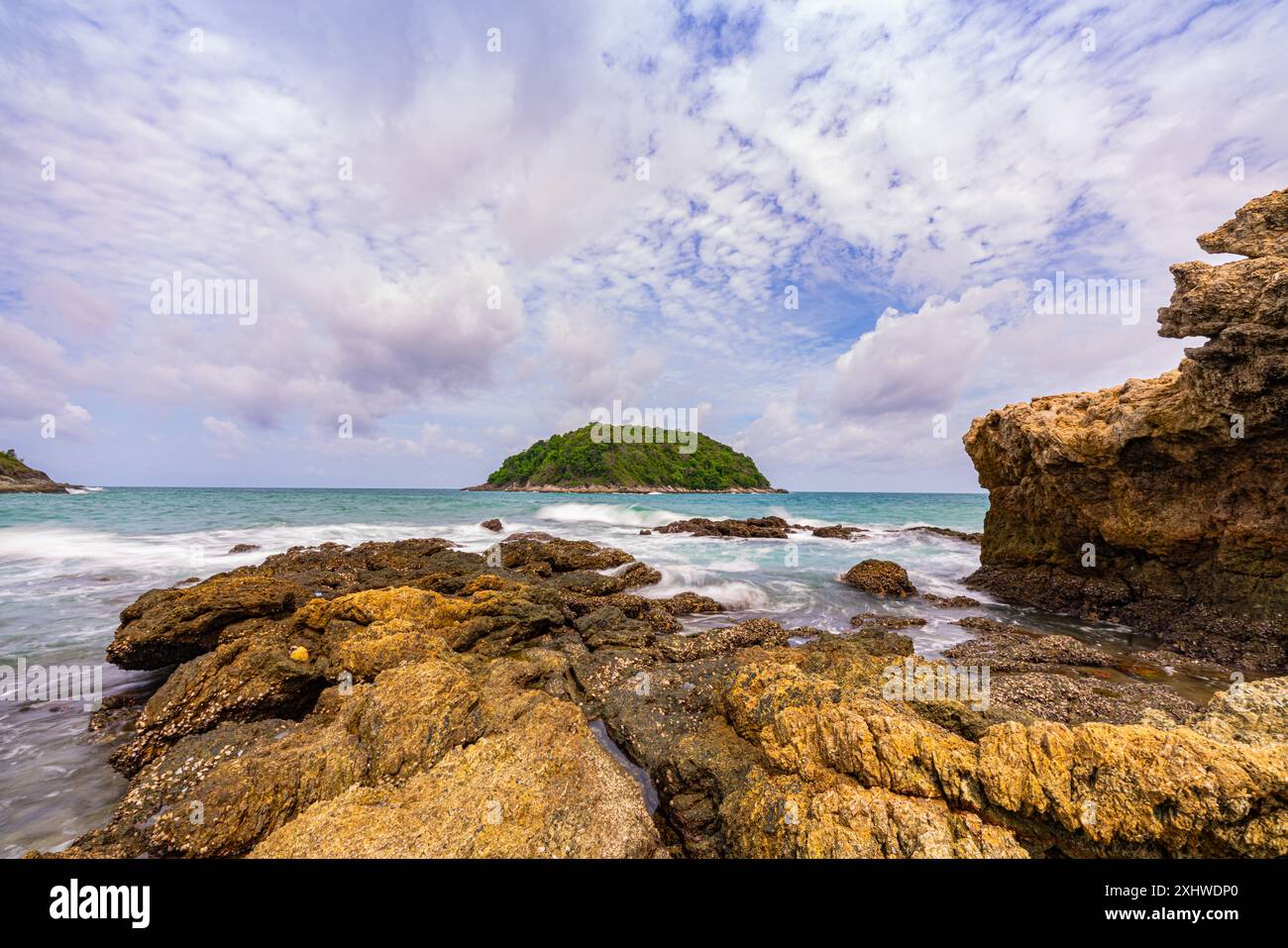 Around the island there are large rocks surrounding it. When a big wave ...