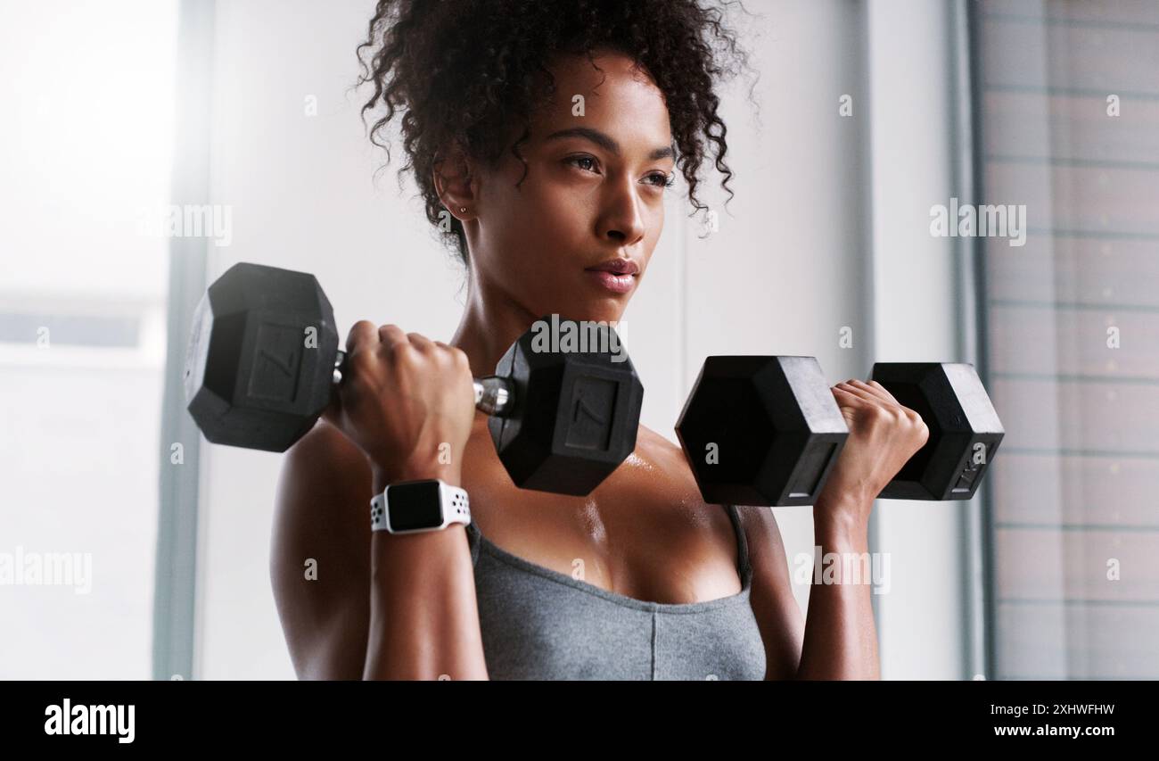 African woman, dumbbells and exercise for fitness with thinking ...
