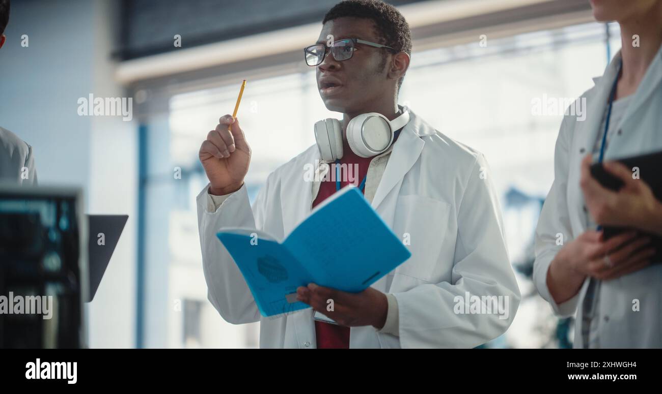 Portrait of a Young Black Male Engineering Student Asking Questions and ...