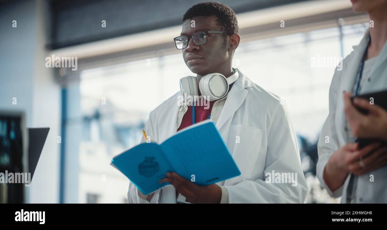 Portrait of a Young Black Male Engineering Student Asking Questions ...