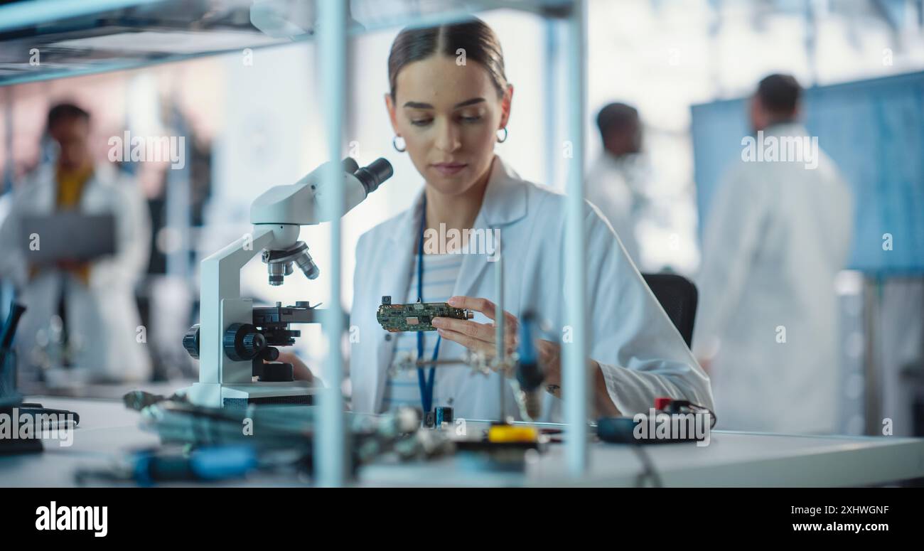 Diverse Young Group of Engineers Working in a Startup Lab. Female ...