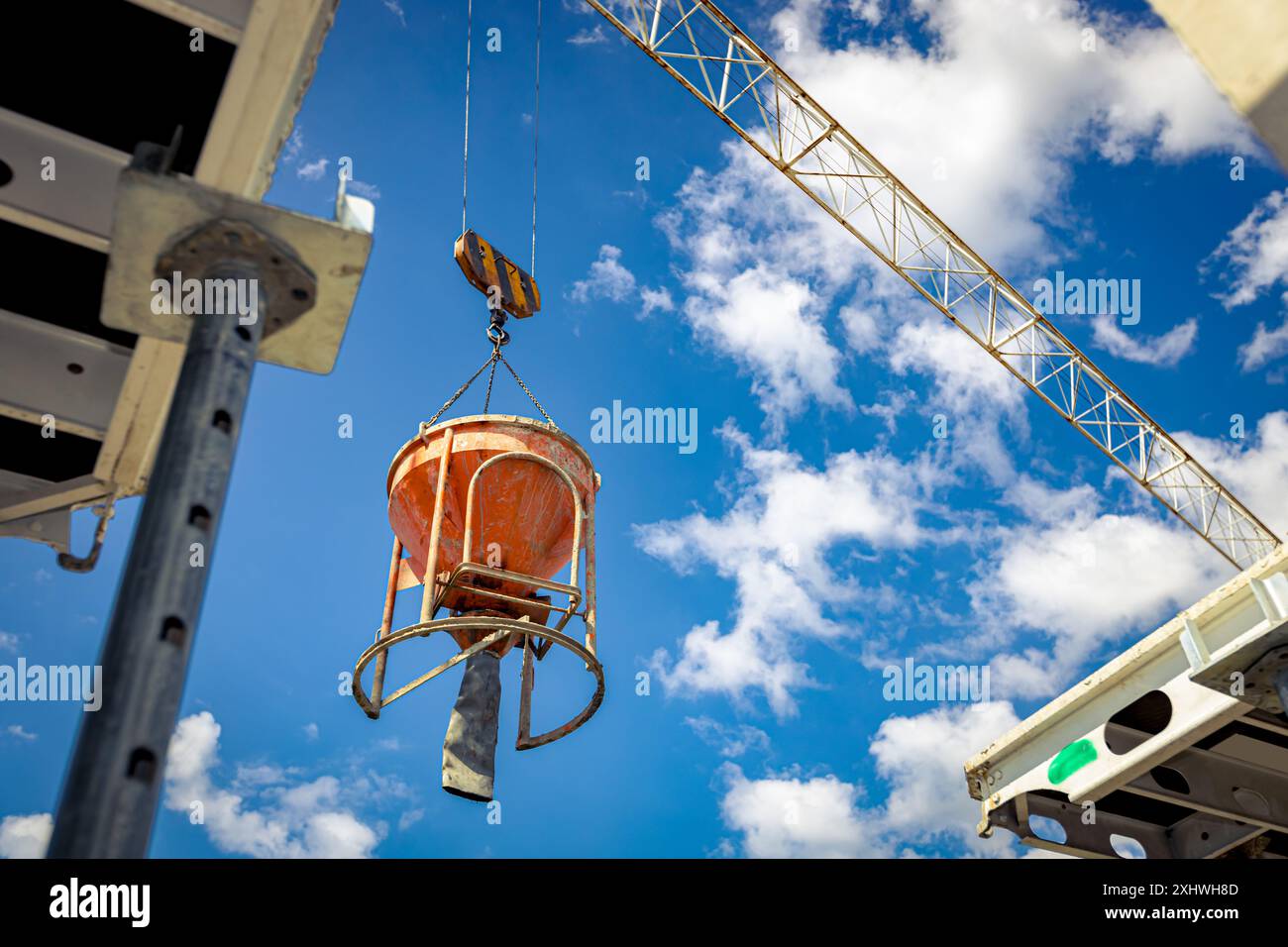 Crane is carry cone tank, conical metal bucket to transport and deliver ...