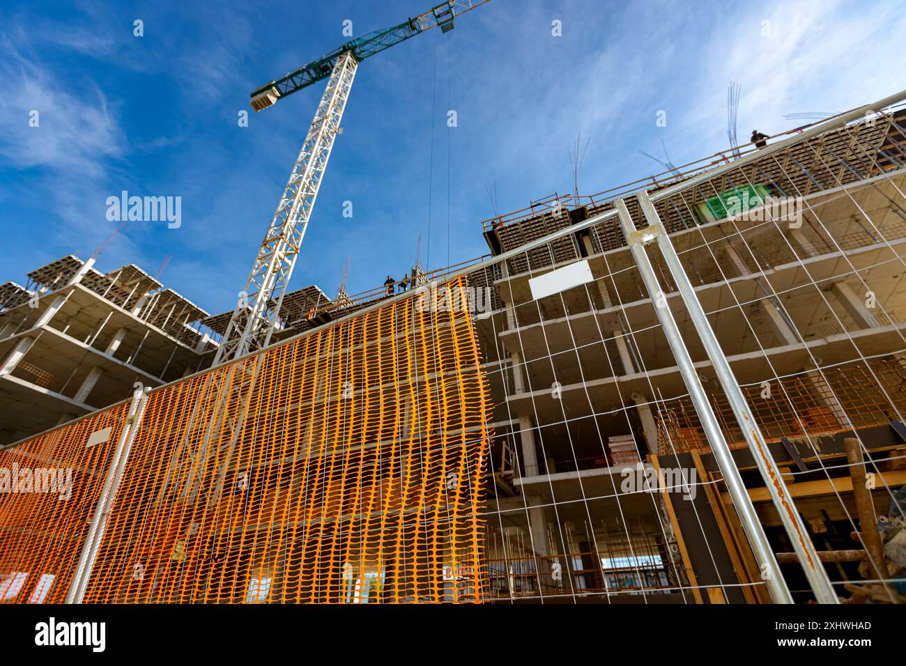 Confined space with orange, plastic, safety mesh is placed around ...
