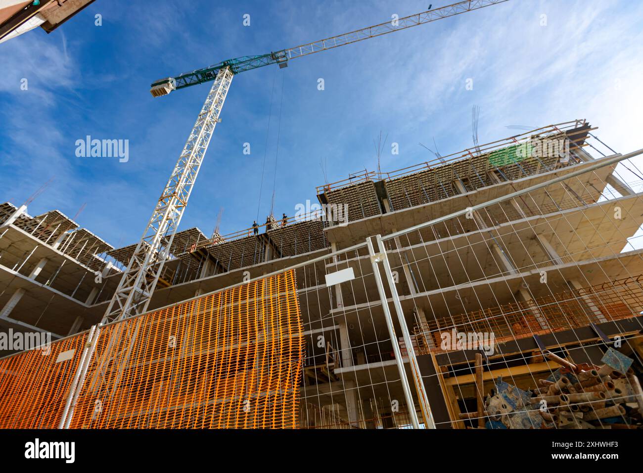 Confined space with orange, plastic, safety mesh is placed around ...