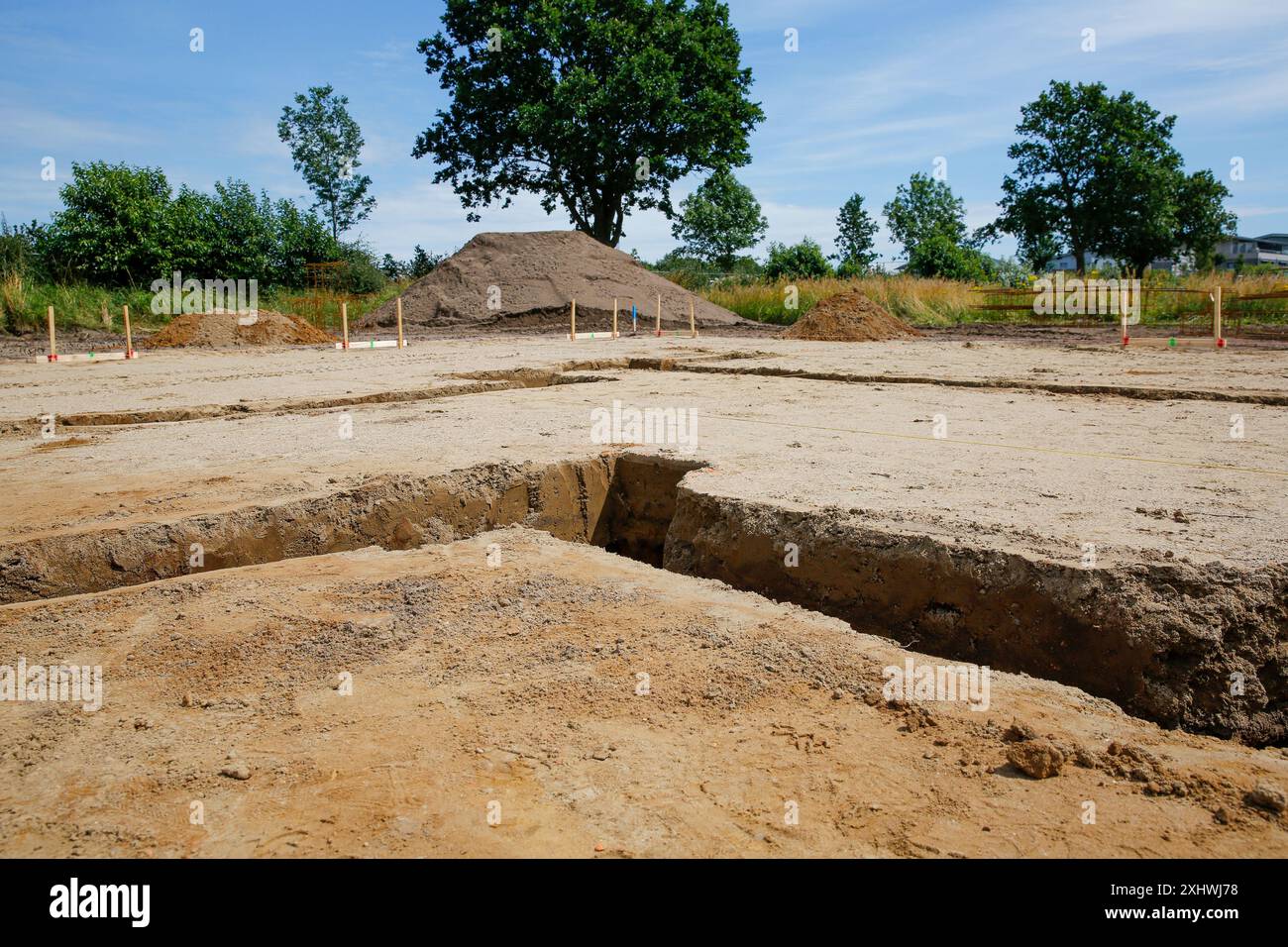 Dugged holes on a construction site. Building house concept Stock Photo ...