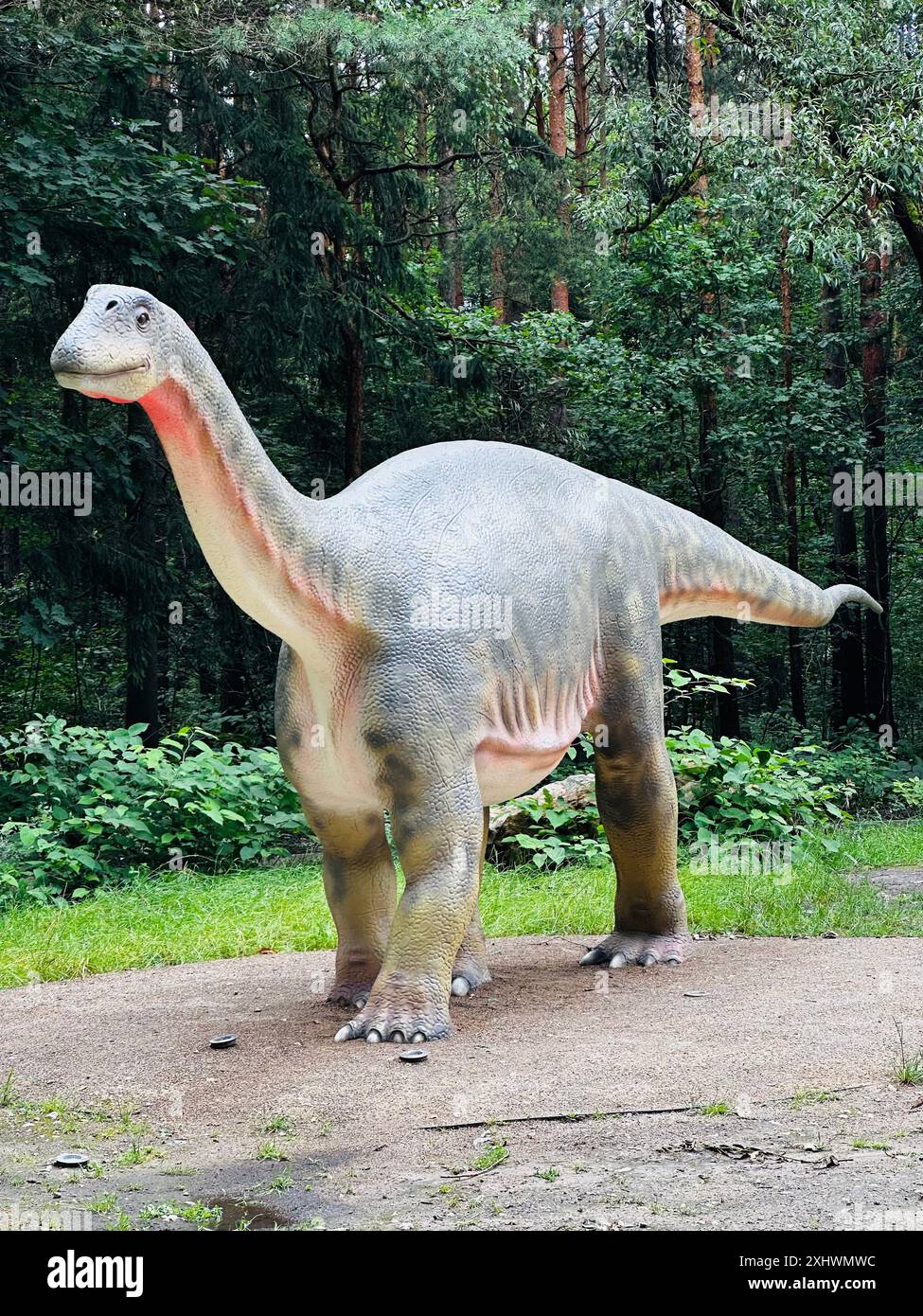 Realistic figure of the Vulcanodon dinosaur in the forest in Kazimierz ...