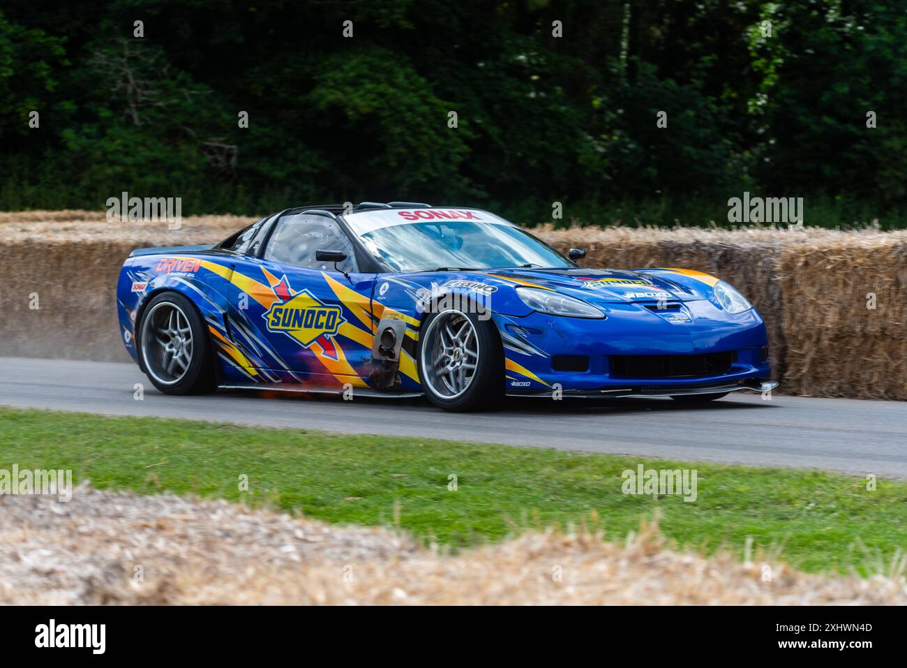 2006 Chevrolet Corvette C6 drift car driving up the hill climb track at ...
