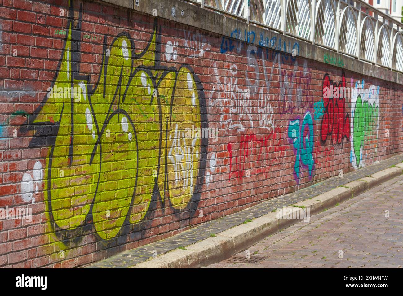 Colorful painted bridge with railing and brick wall, Germany Stock ...