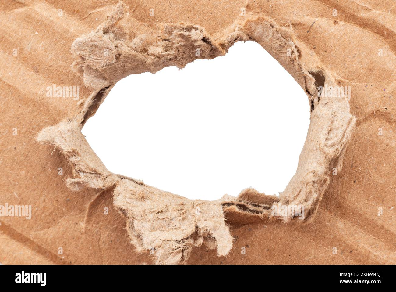 Hole in cardboard. A torn piece of cardboard or paper. Blank space for ...