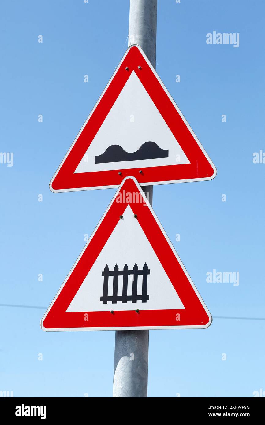 Danger sign, traffic sign for gated level crossing, uneven roadway ...