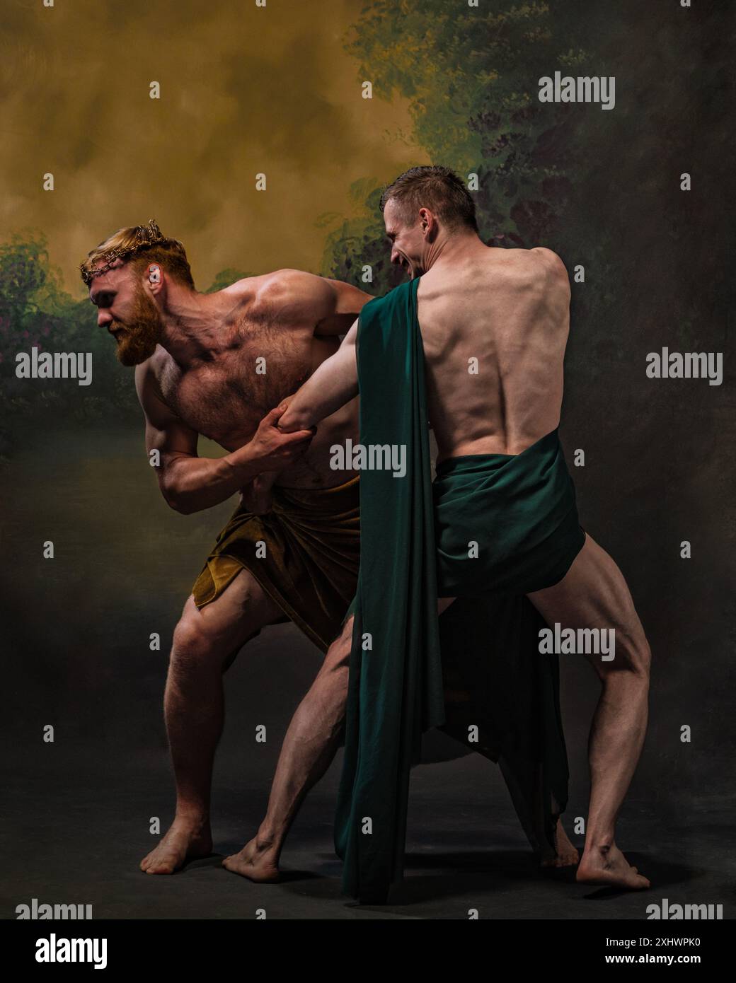 Two men in classical attire wrestling. Their muscular forms and intense ...
